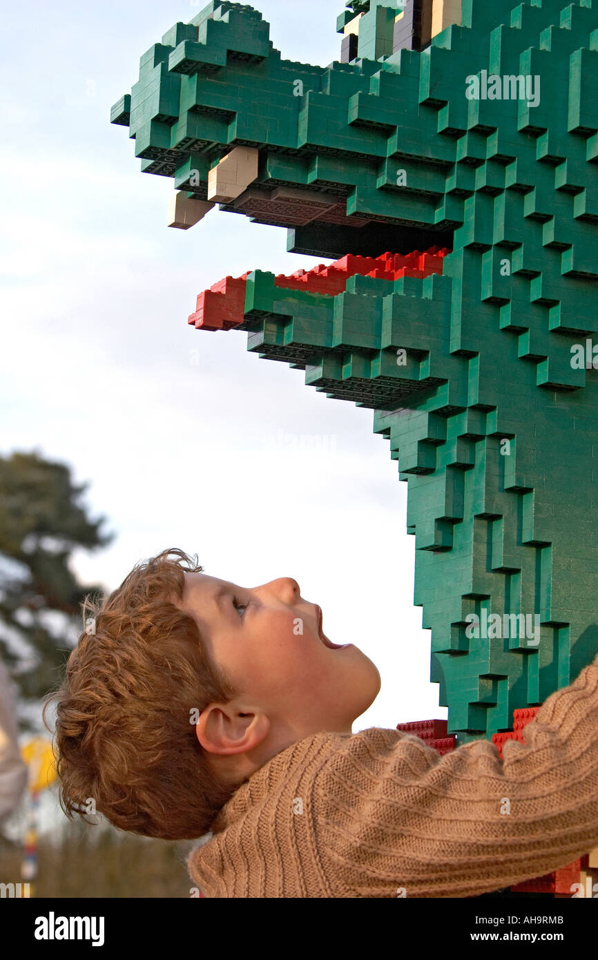 Young boy child with cartoon animal model in Legoland theme park family ...