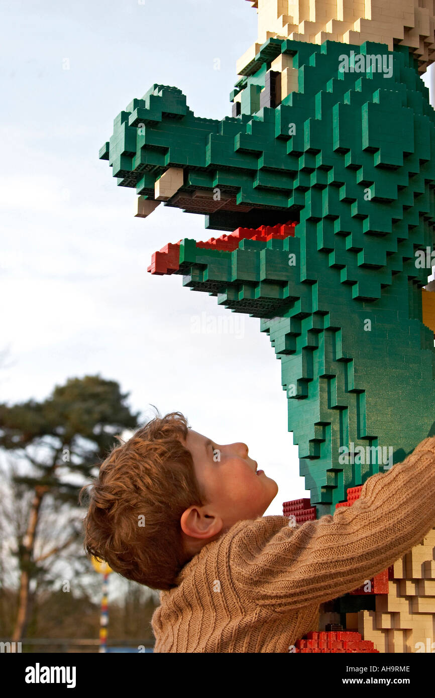 Young boy child with cartoon animal model in Legoland theme park family ...