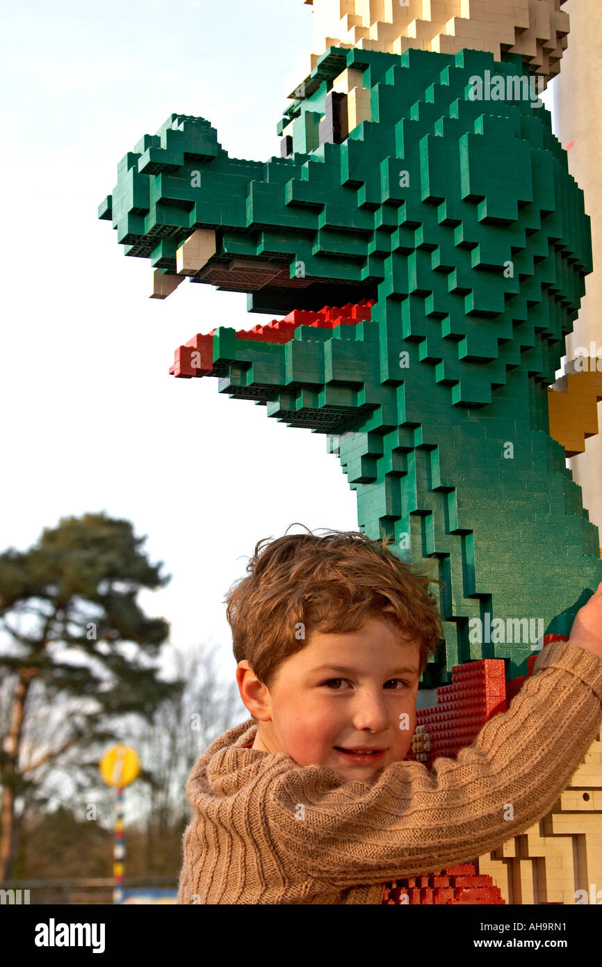 Young boy child with cartoon animal model in Legoland theme park family ...
