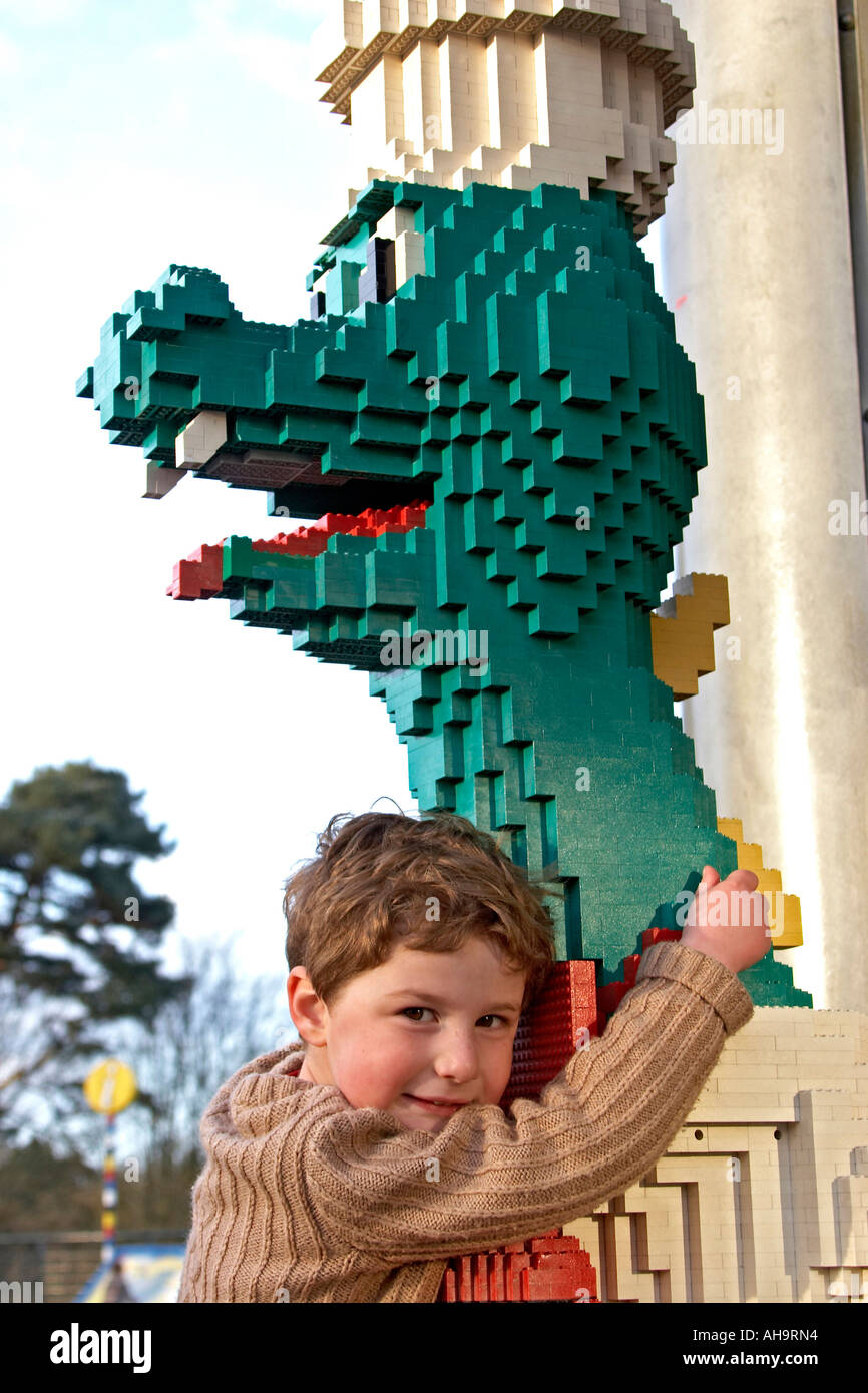 Young boy child with cartoon animal model in Legoland theme park family ...