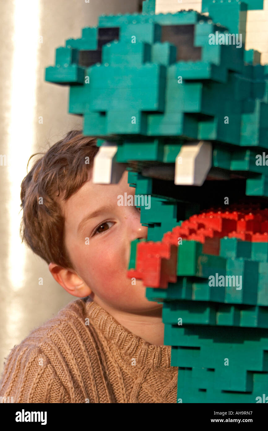 Young boy child with cartoon animal model in Legoland theme park family ...