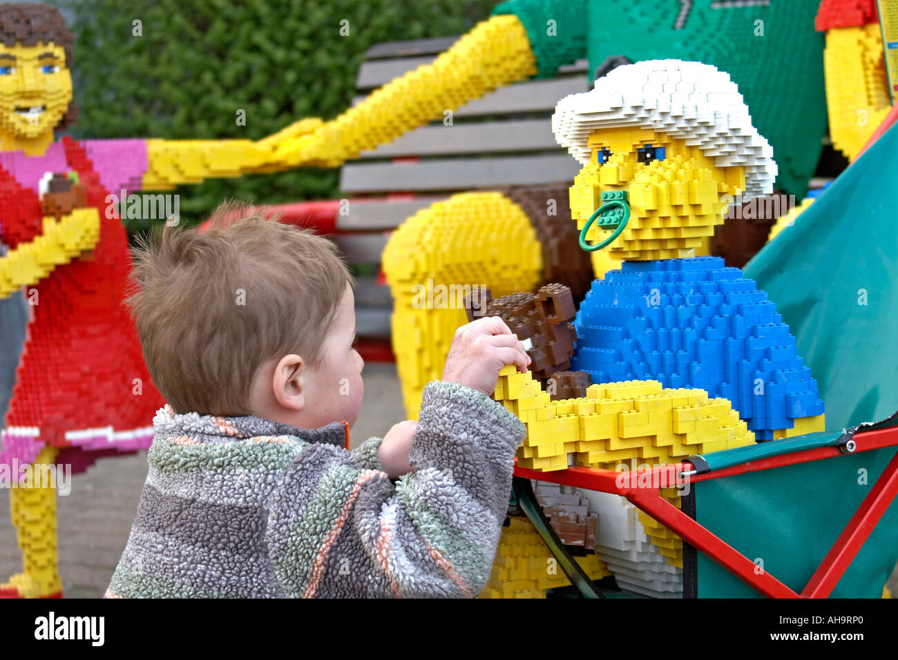 Young boy child with model lego family in Legoland theme park family ...