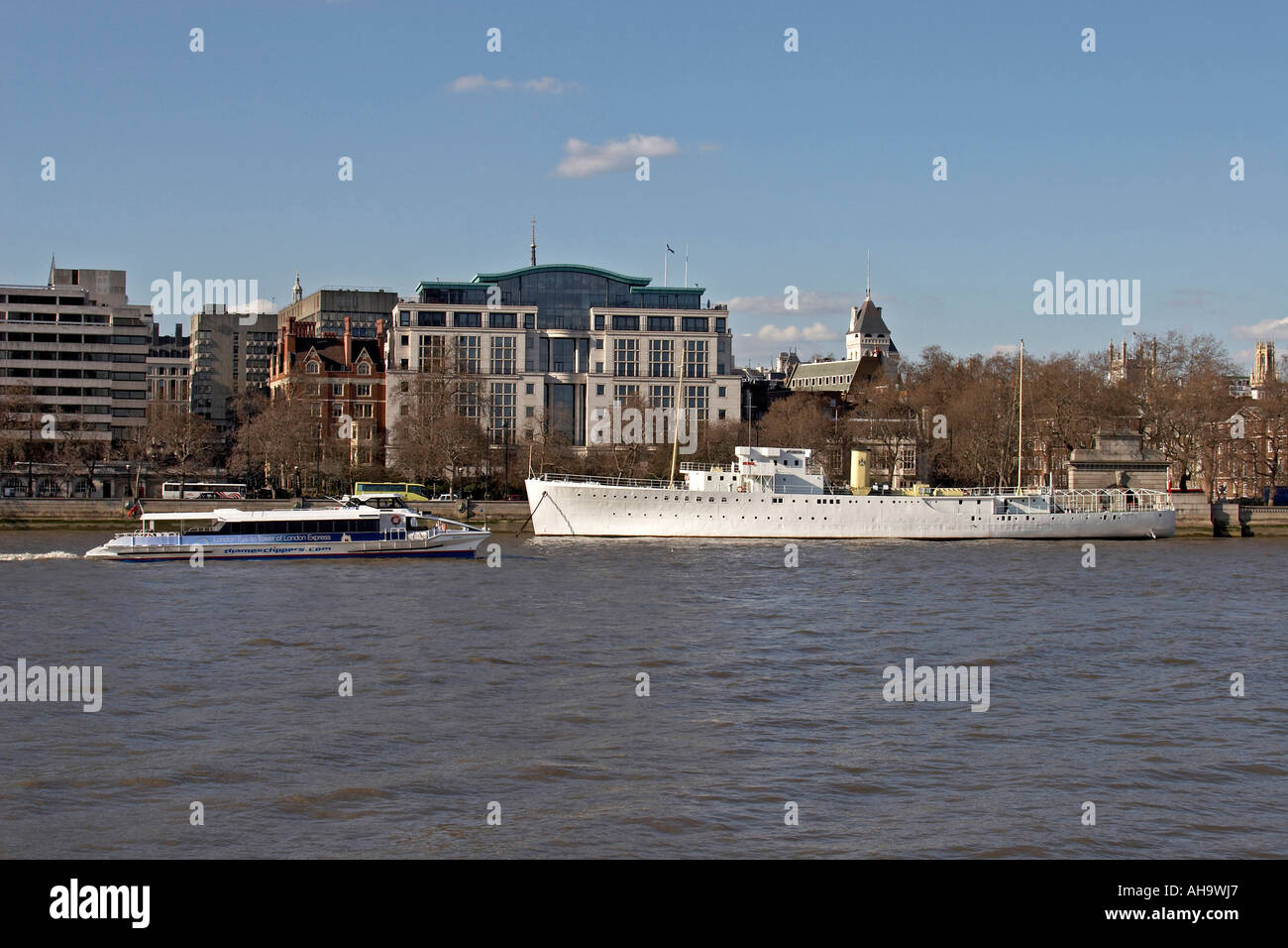 View north across River Thames to HQS Wellington ship moored on ...