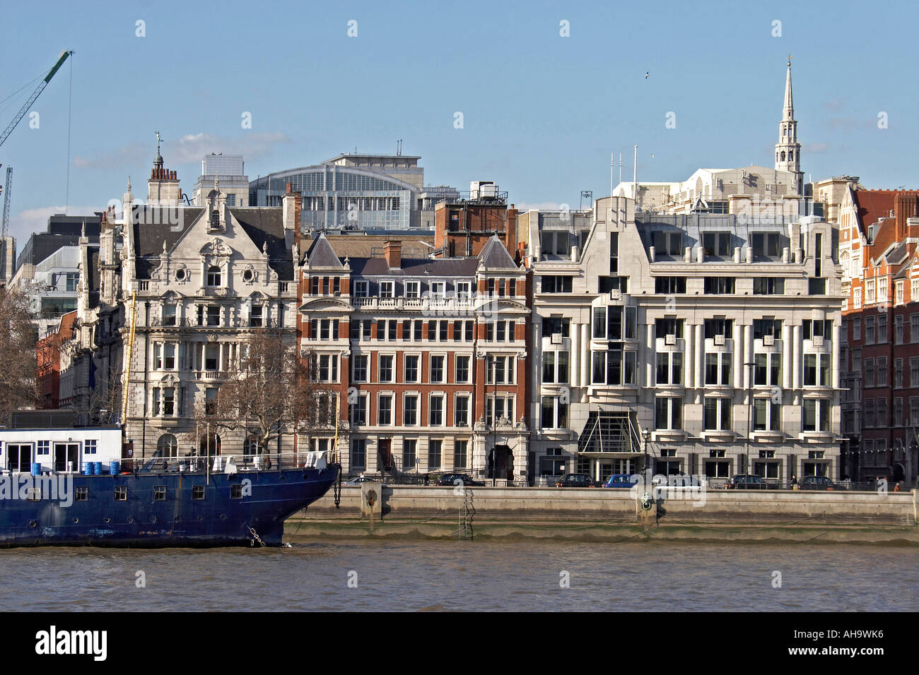 View on sunny day north across River Thames with boats HMS President ...
