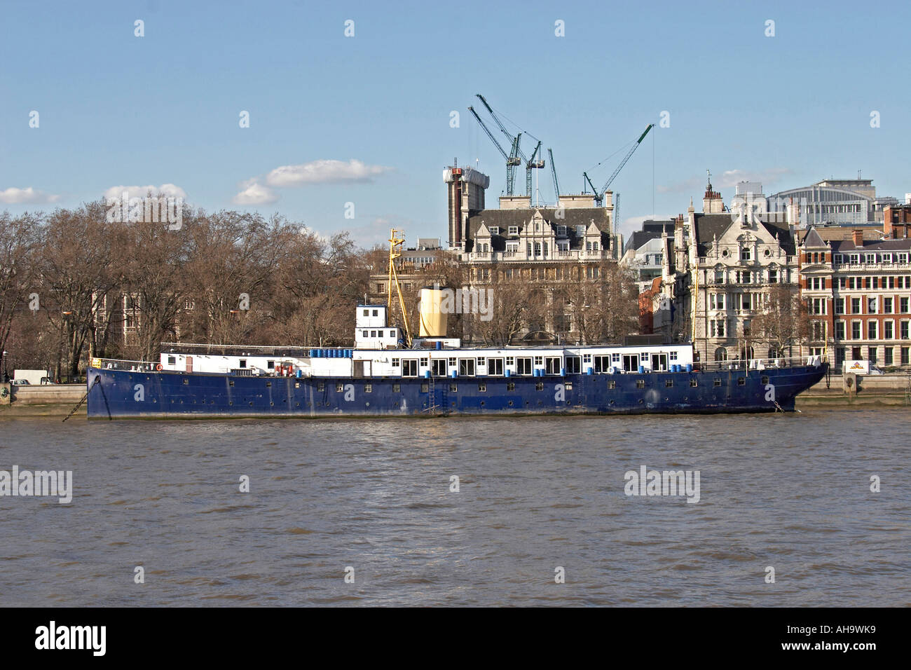 View on sunny day north across River Thames with HMS President ship and ...