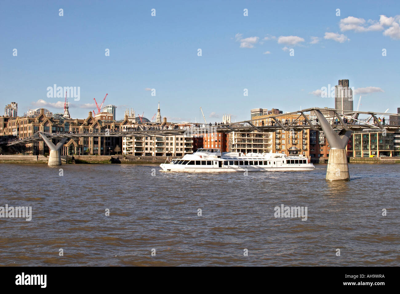 View north across River Thames with Millenium Bridge and Silver Fleet ...