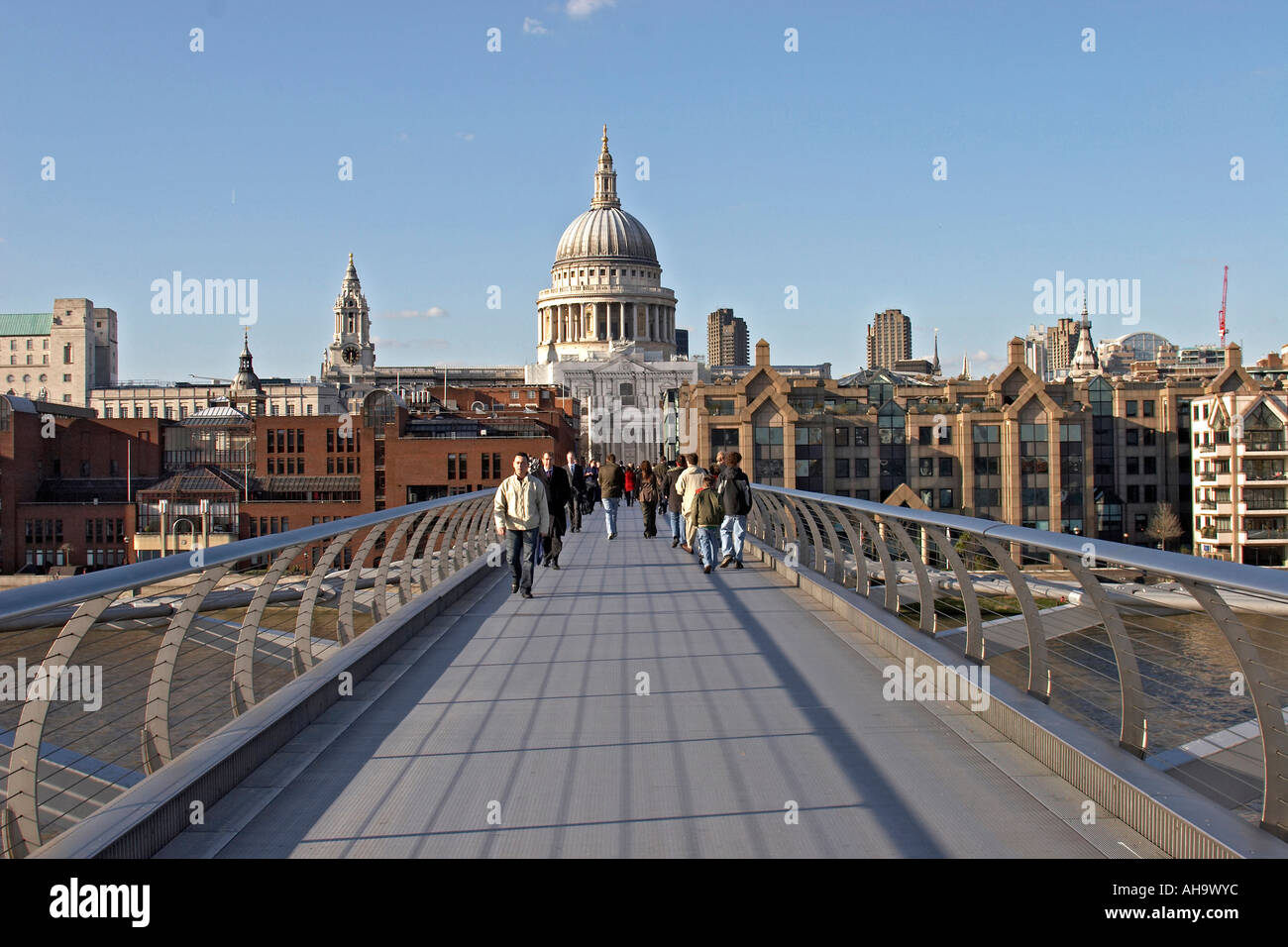 People walking across Millenium Bridge Stock Photo - Alamy