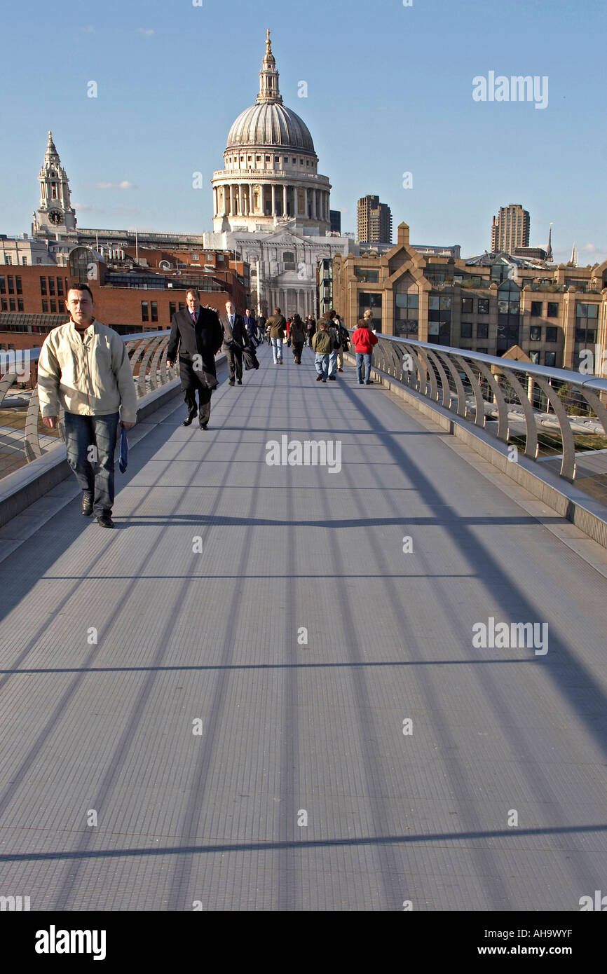 People walking across Millenium Bridge Stock Photo - Alamy