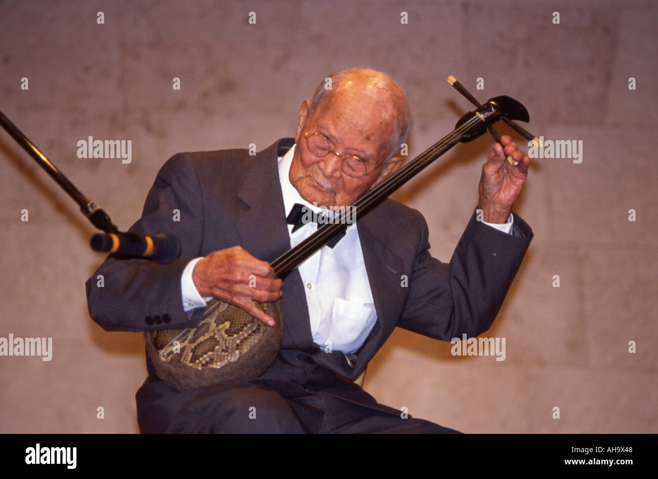 90 something year old Okinawan man plays the sanshin Okinawan shamisen ...