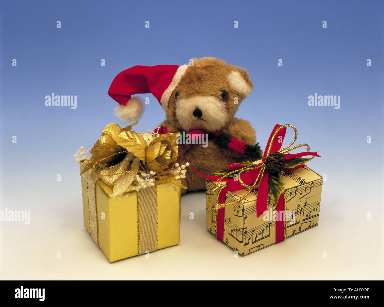 Christmas gift boxes and teddy bear Stock Photo - Alamy