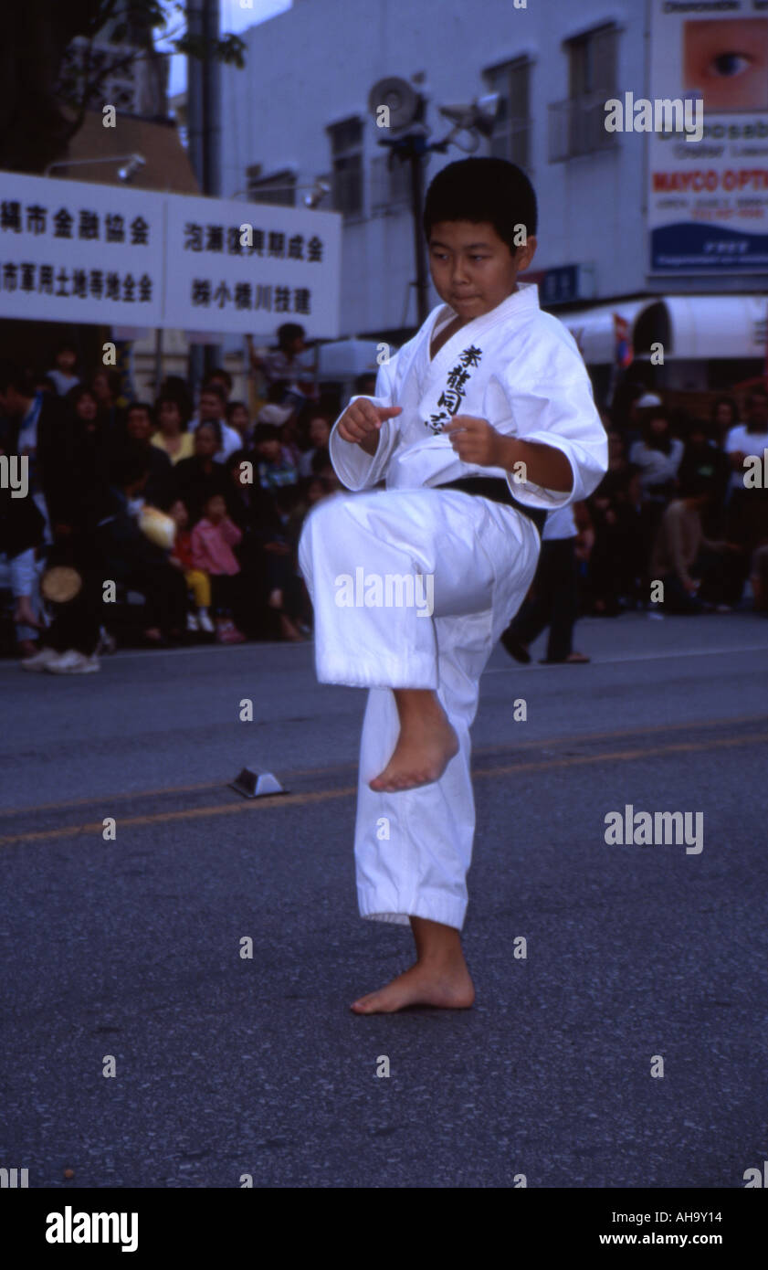 Girl performs karate demonstration on the street in Okinawa Japan Stock ...