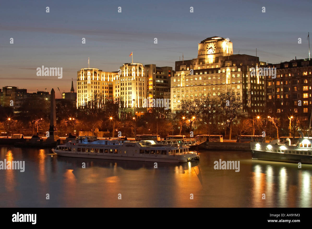 Twilight dusk night view west along River Thames with Adelphi Building ...