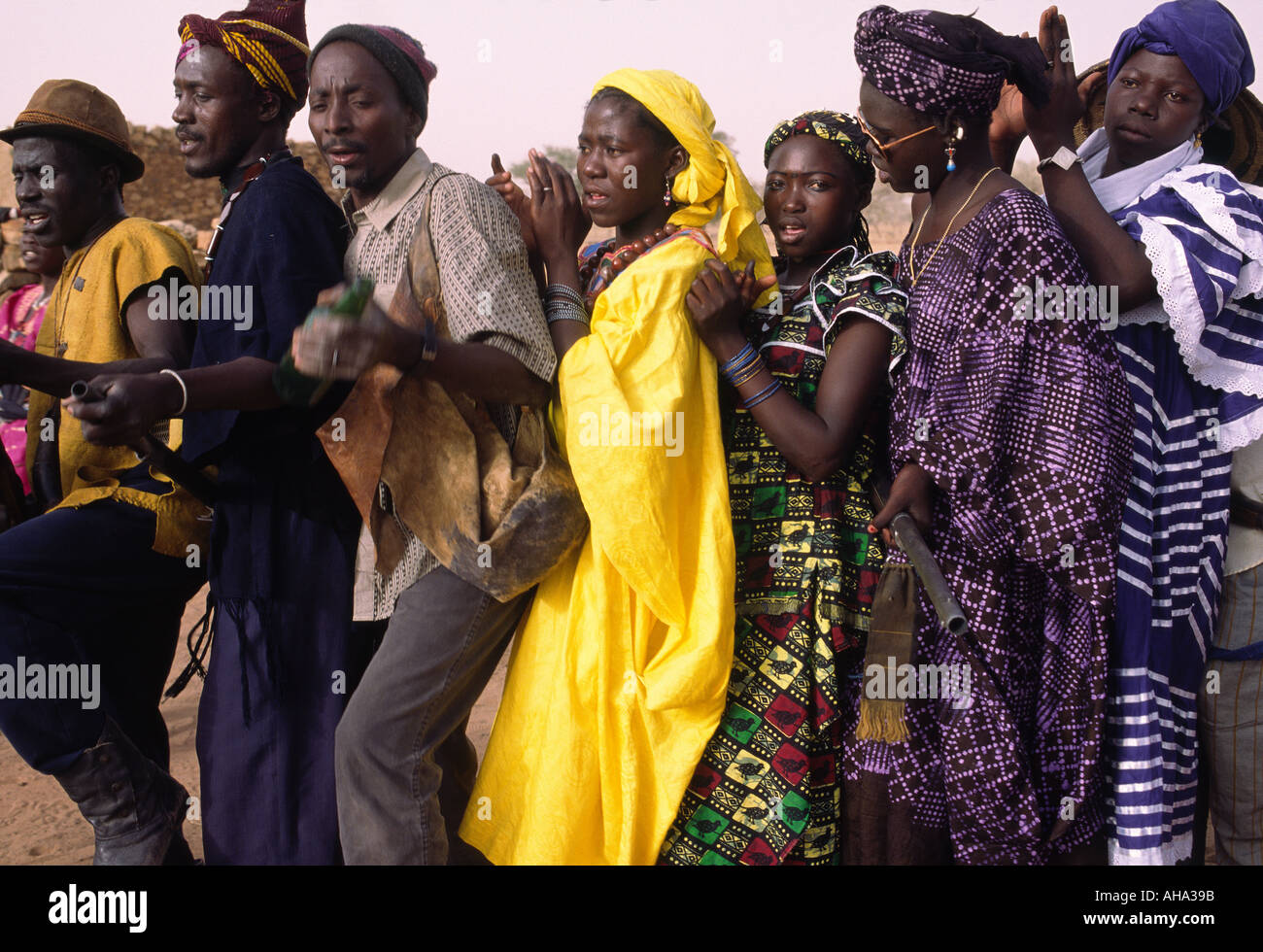 Dogon men and women dance in procession during a village celebration ...
