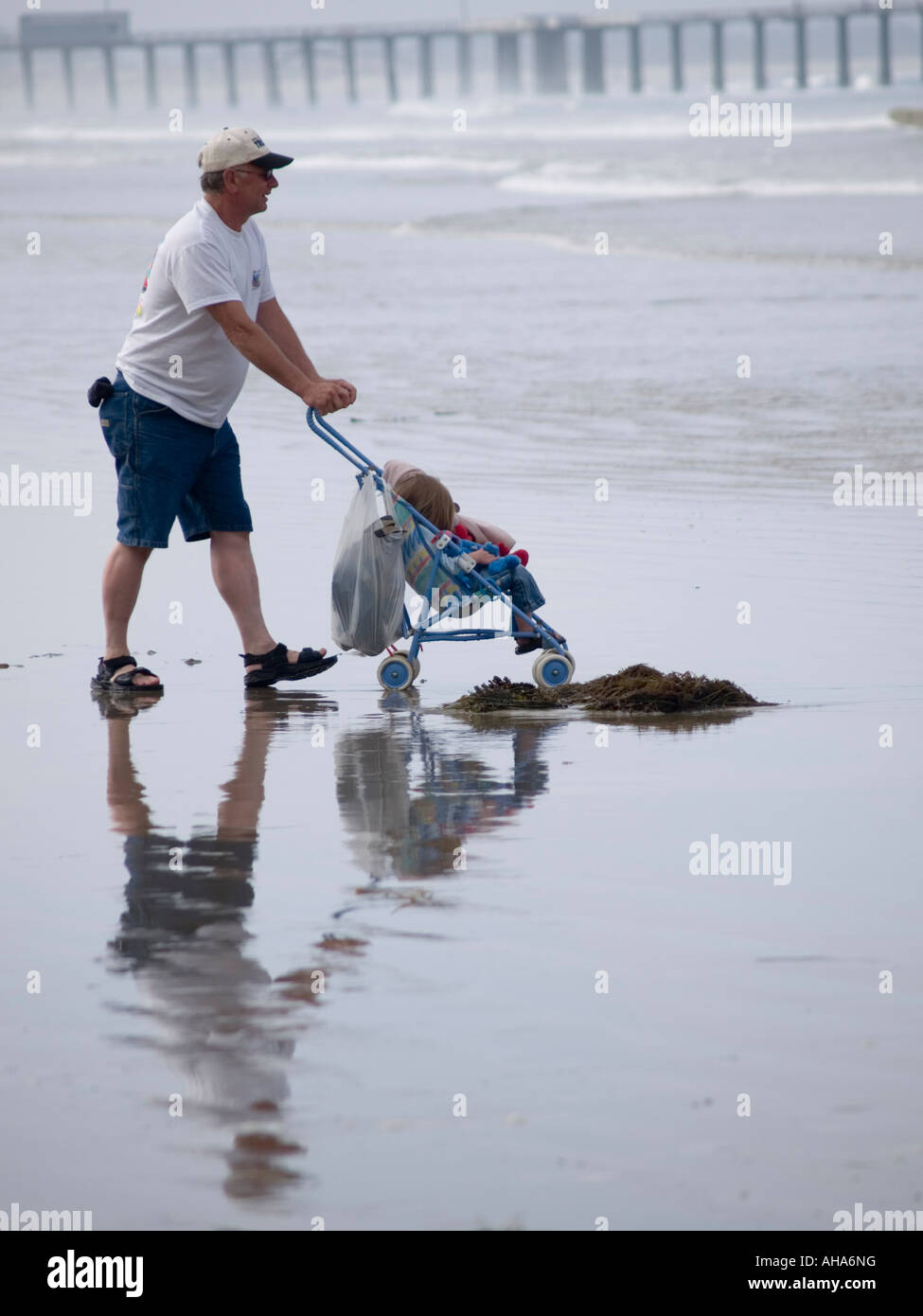 Stroller and parent at the beach Stock Photo - Alamy