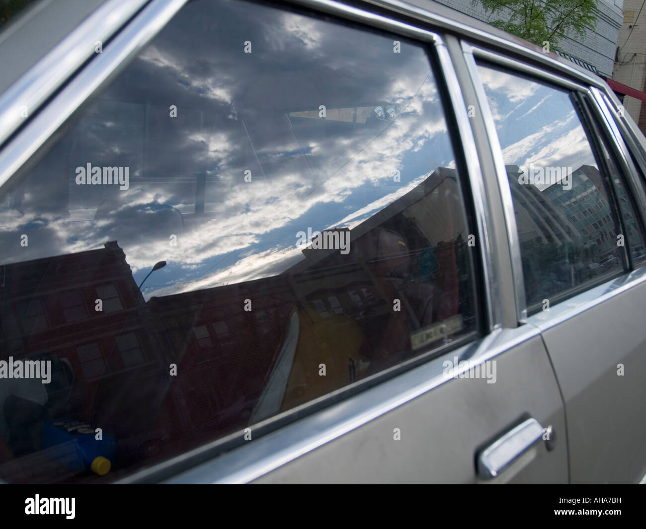 Clouds reflected in a car window Stock Photo - Alamy