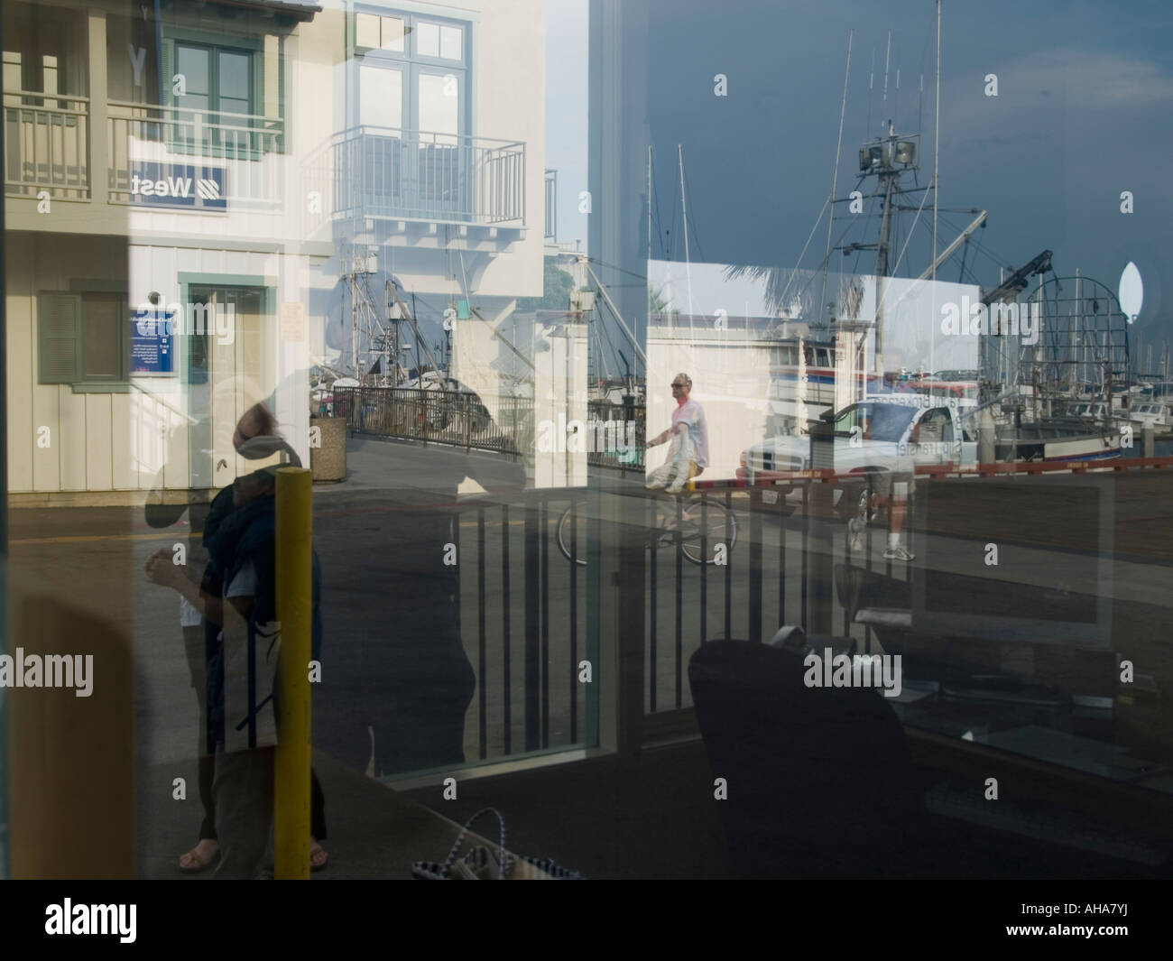 Reflections of harbor in shop windows Stock Photo - Alamy