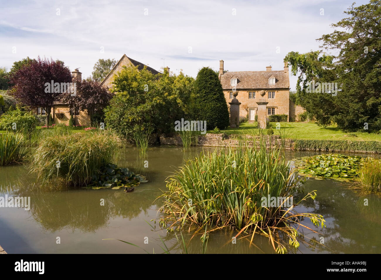 The pond on the green in the Cotswold village of Willersey ...