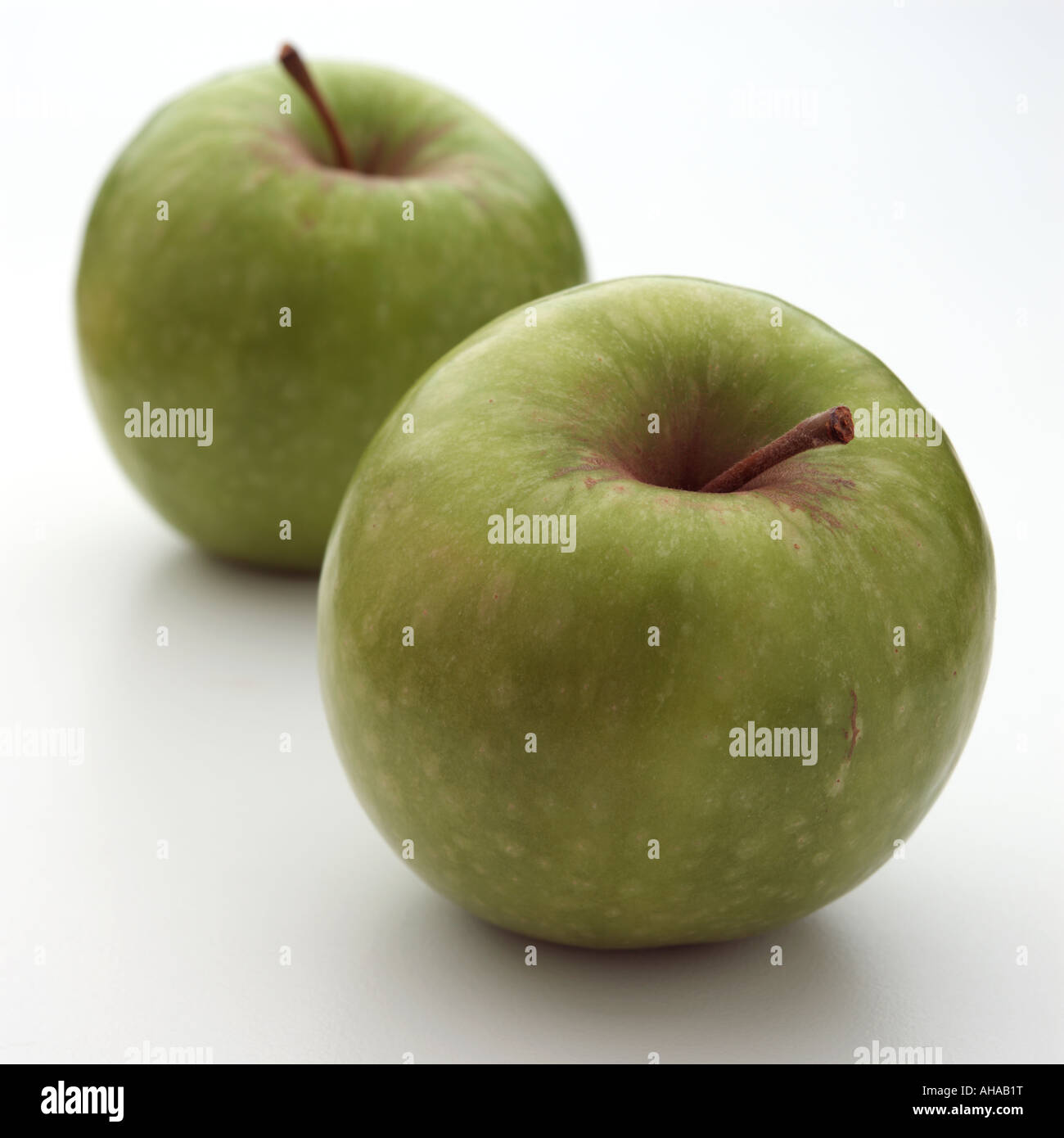 Two golden delicious apples on a white background editorial food Stock ...