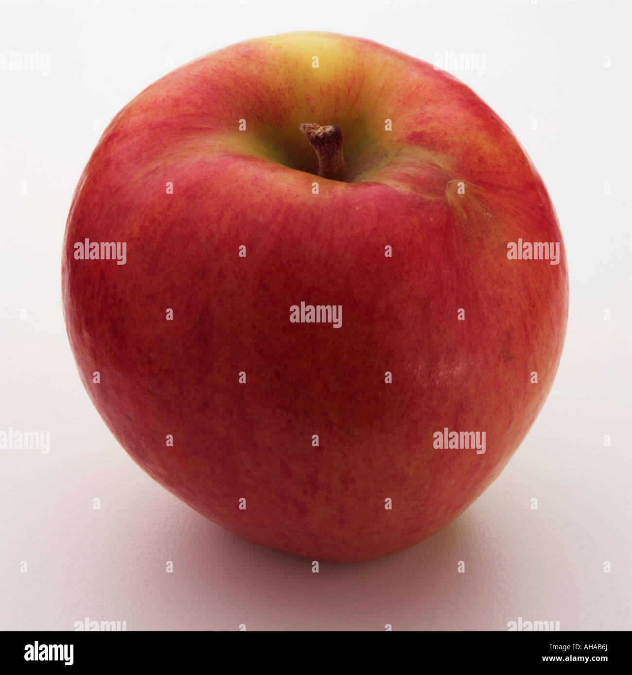 A red gala apple on a white background editorial food Stock Photo - Alamy