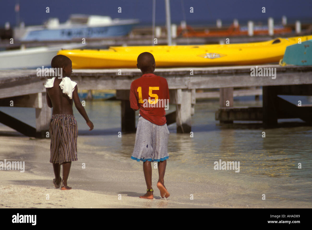 boys on Beach in Belize Stock Photo - Alamy