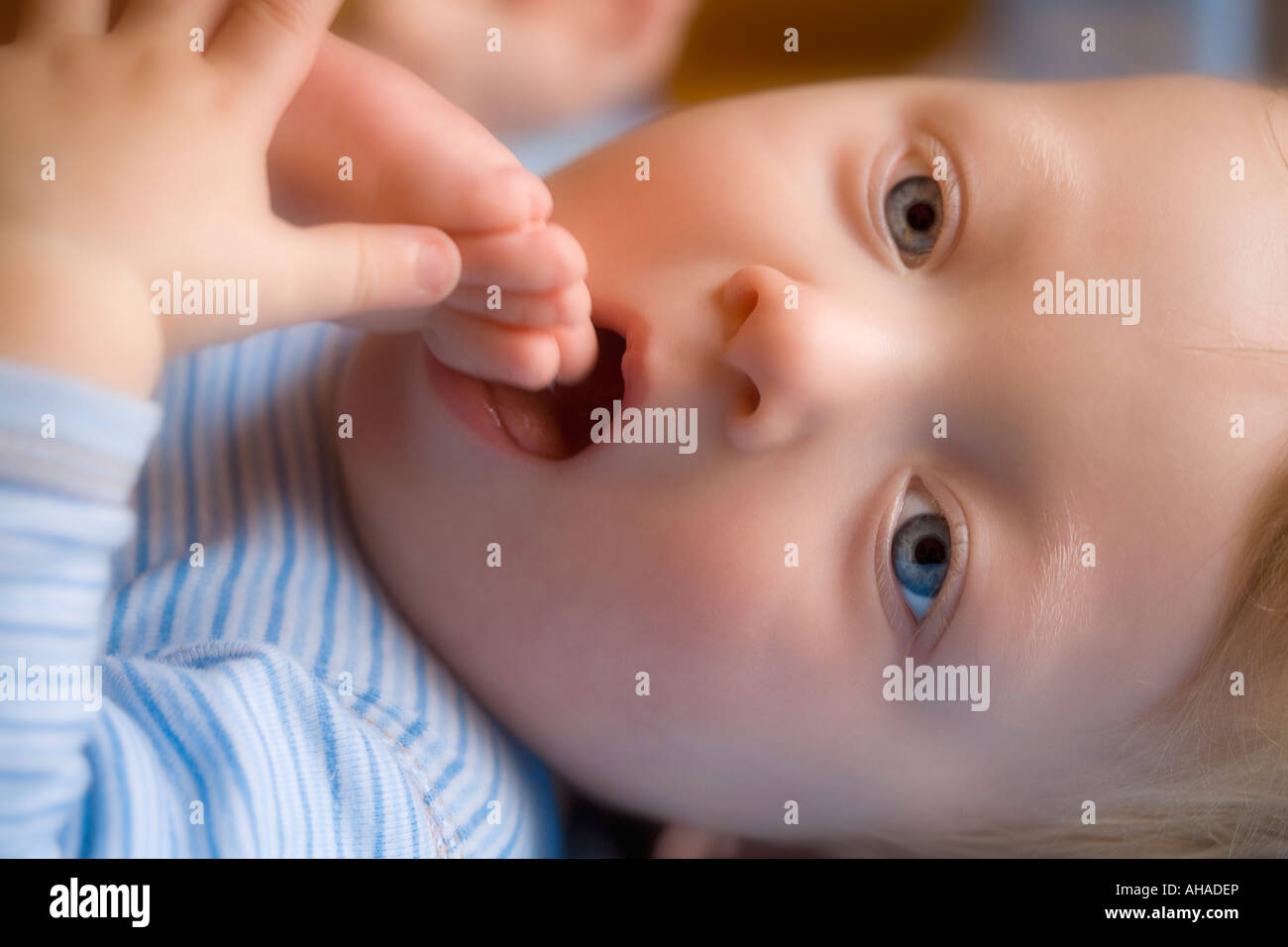 Child sucking foot hi-res stock photography and images - Alamy