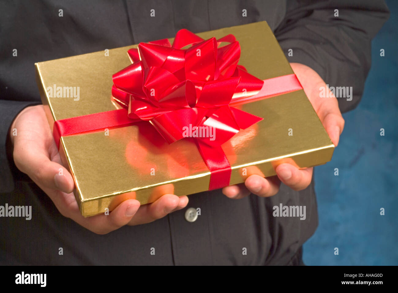 Mans hands give gift hi-res stock photography and images - Alamy