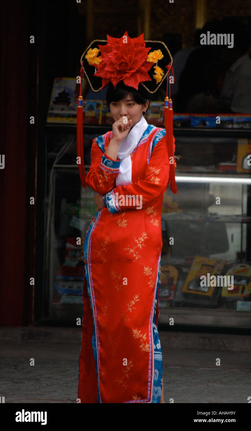Chinese sales girl in traditional dress Stock Photo - Alamy