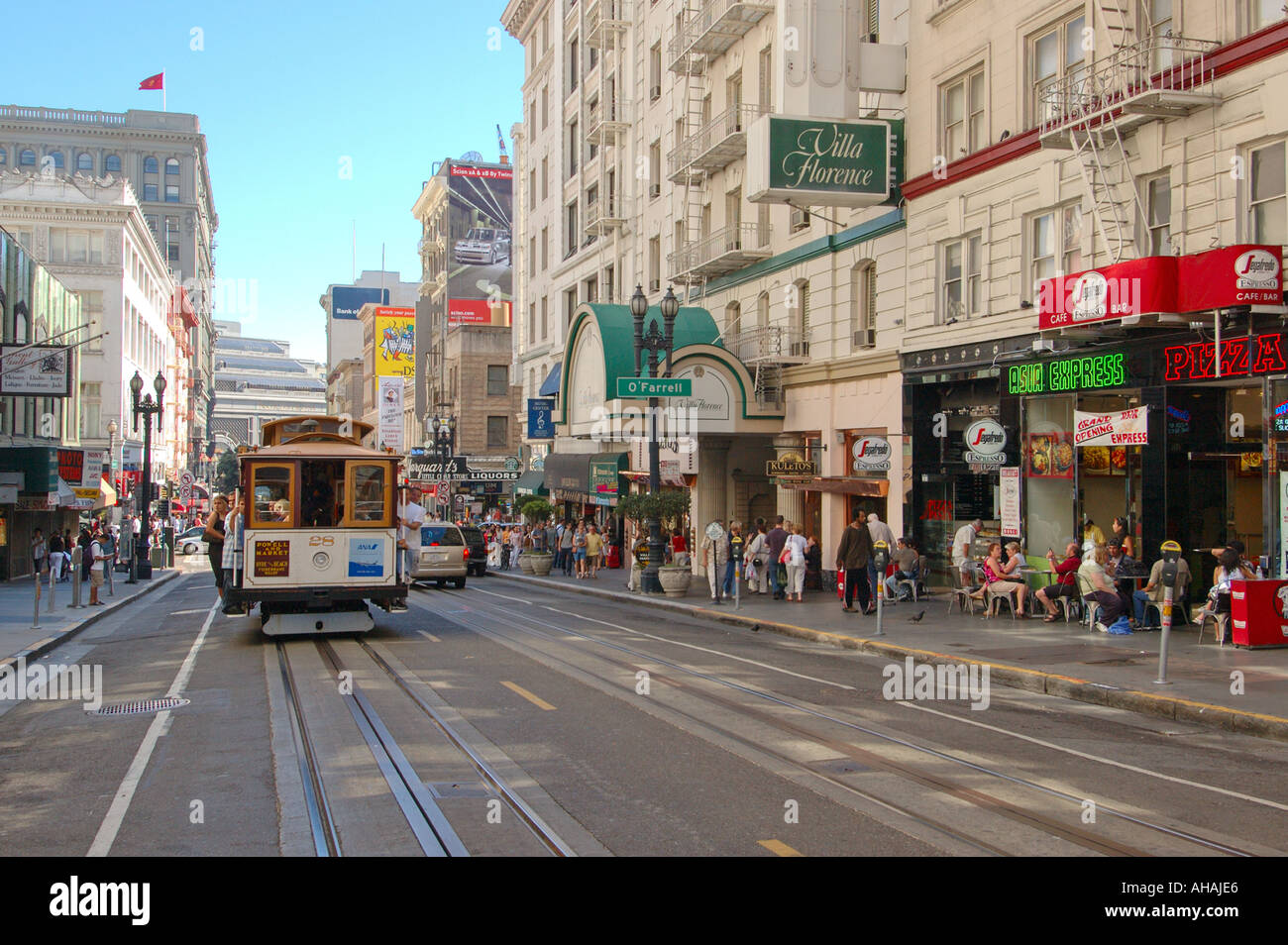 A tourist filled cable car makes it s way up a Union Square street in ...