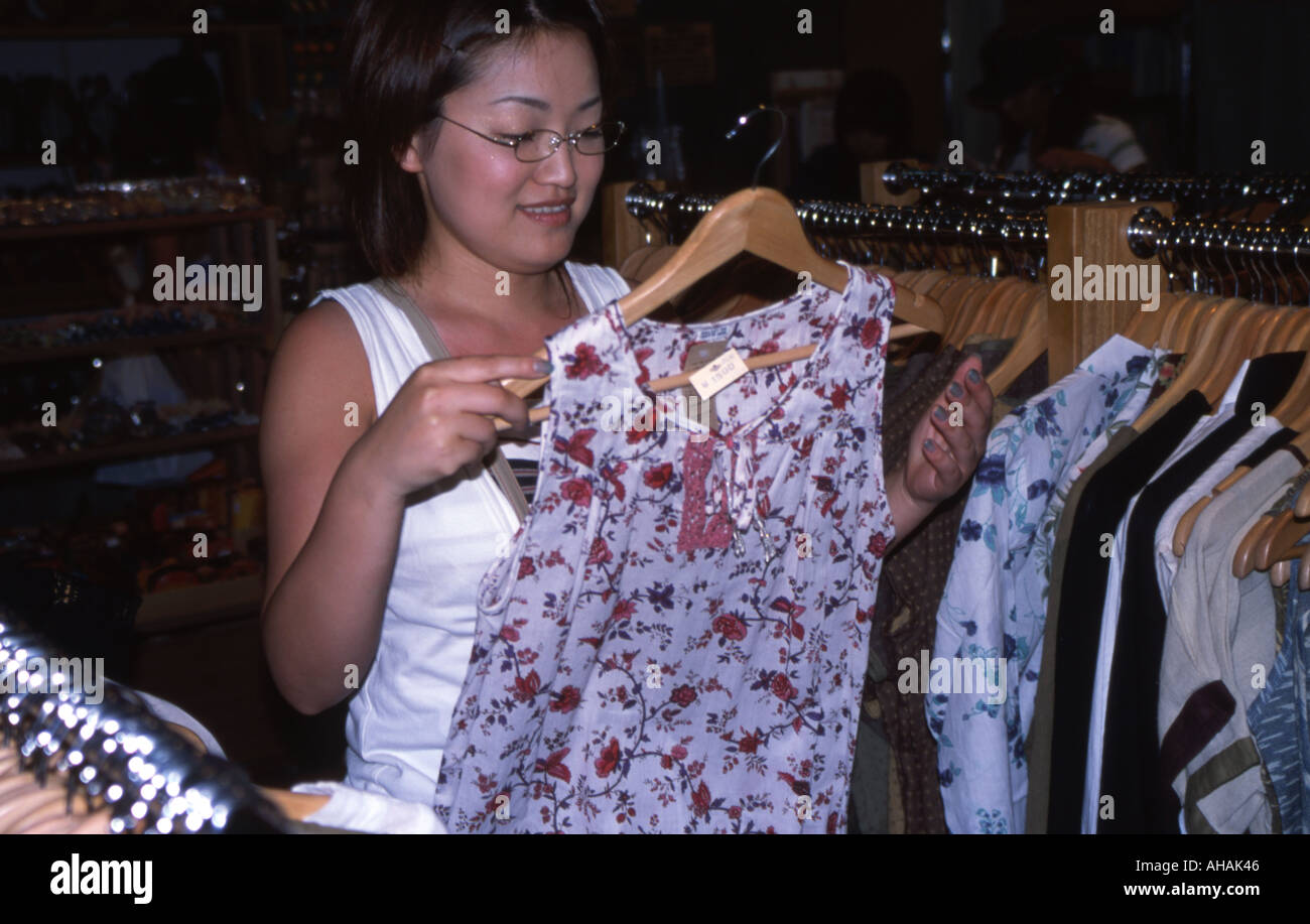 Japanese girl shopping for clothes on Kokusaidori Naha Okinawa Japan ...