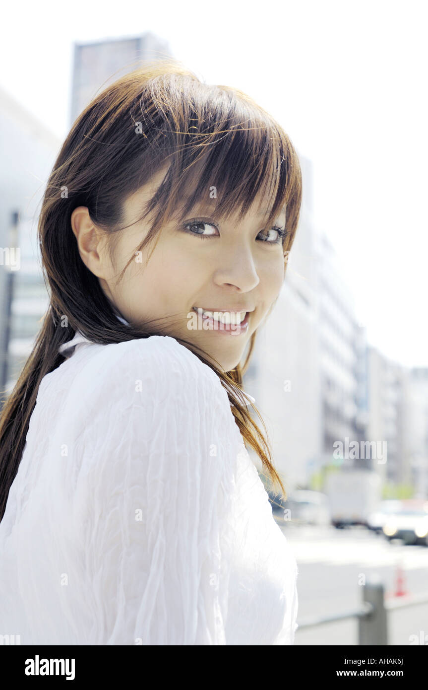 Woman at the street corner Stock Photo - Alamy