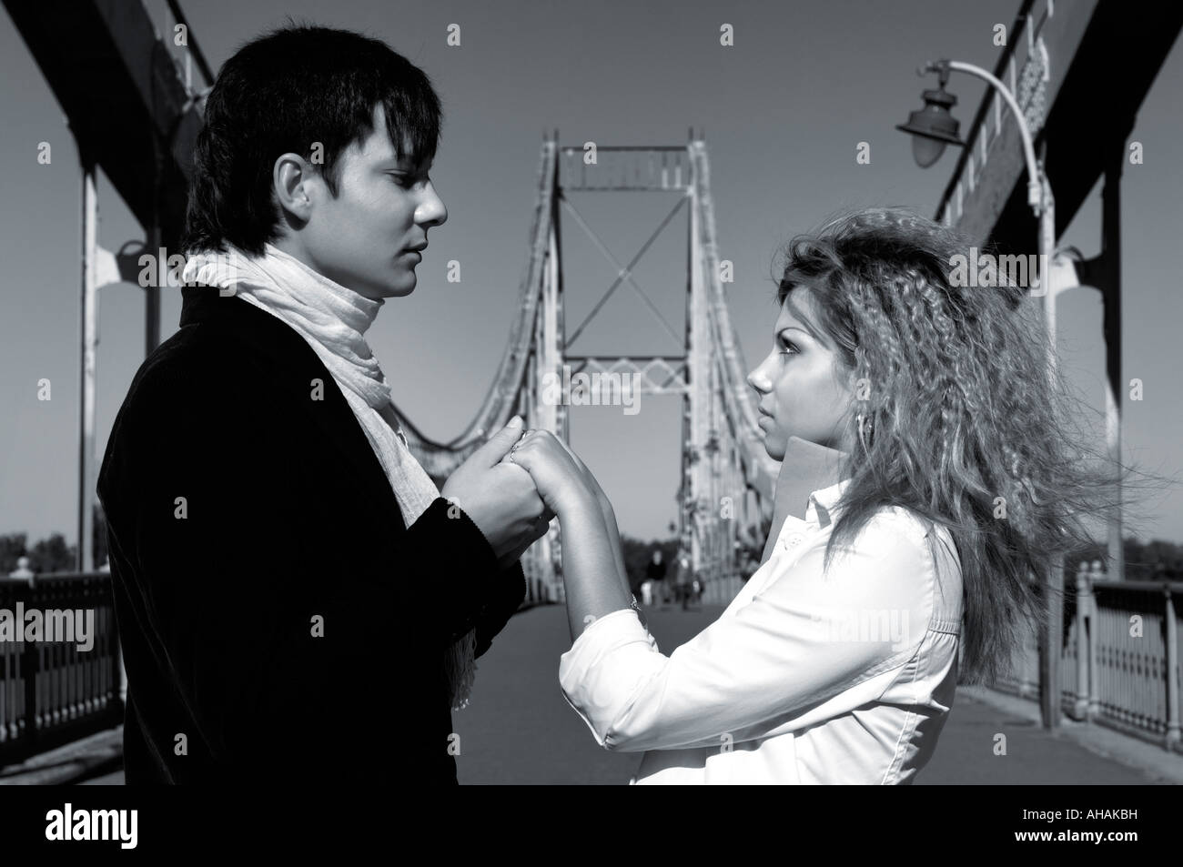 Romantic young couple on the bridge Stock Photo - Alamy