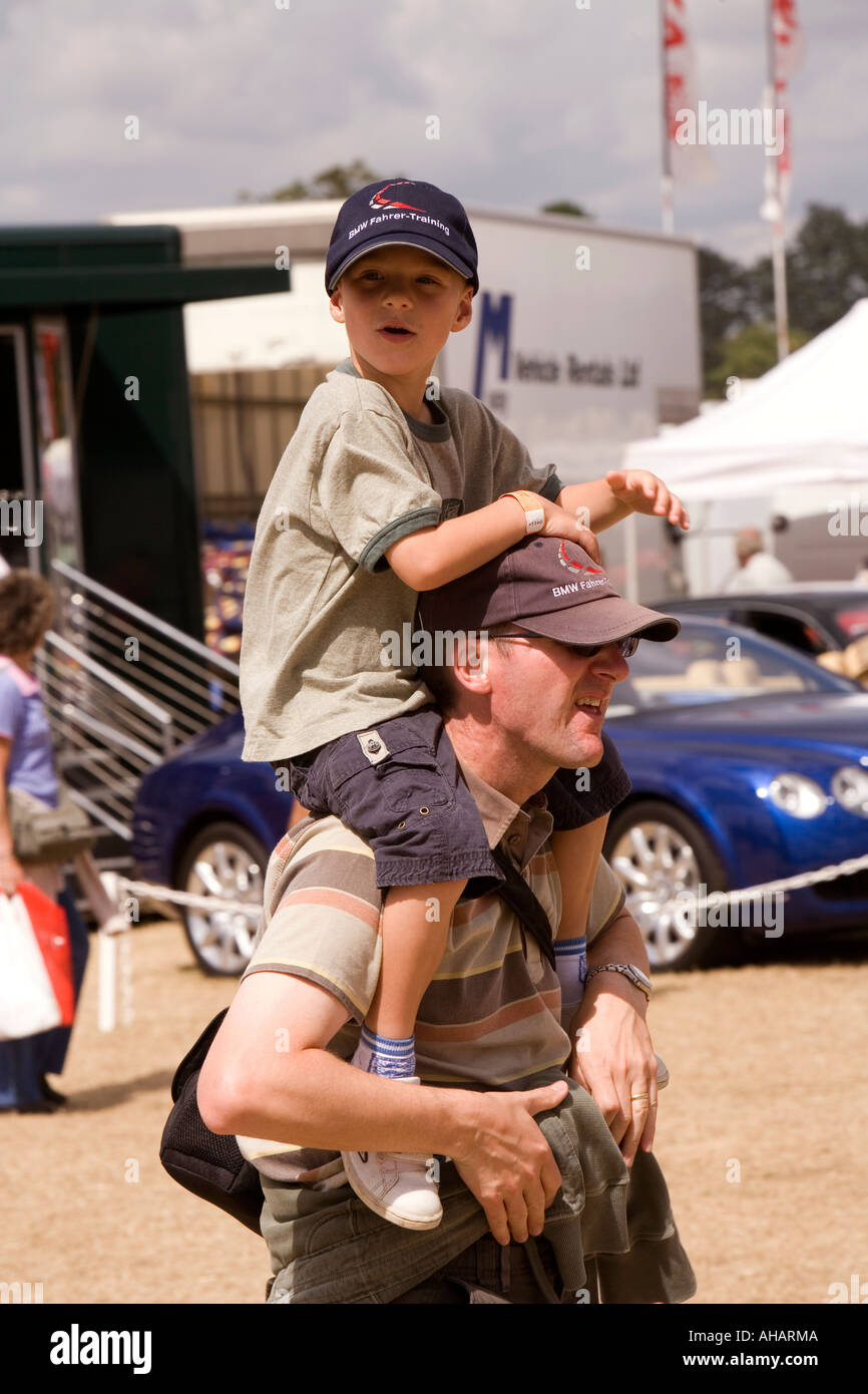 UK Hampshire Romsey Broadlands CLA Game Fair boy carried on his fathers ...