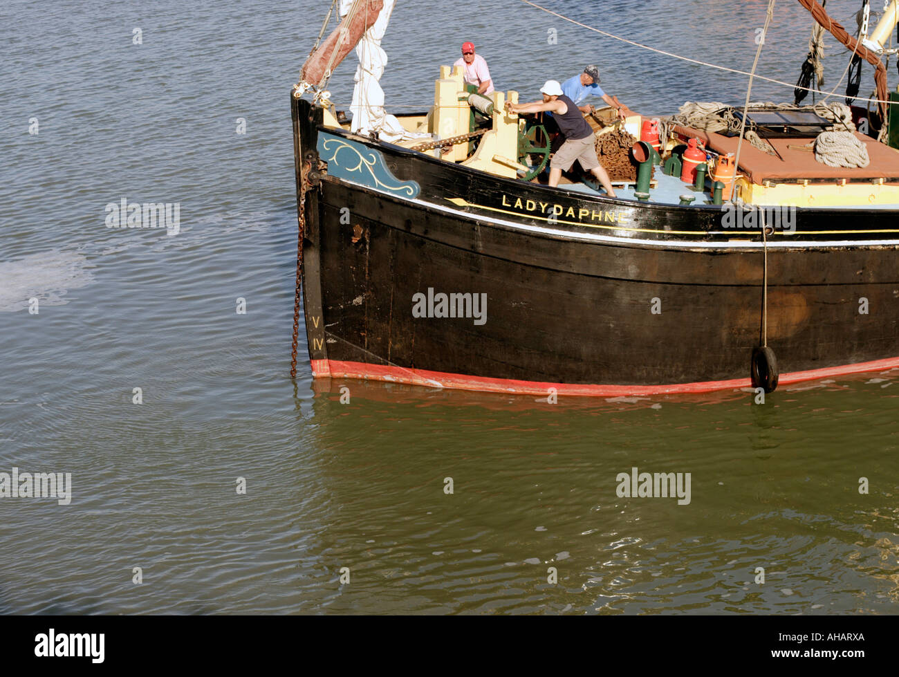 Crew working in bow section of ocean going sailing barge Stock Photo ...