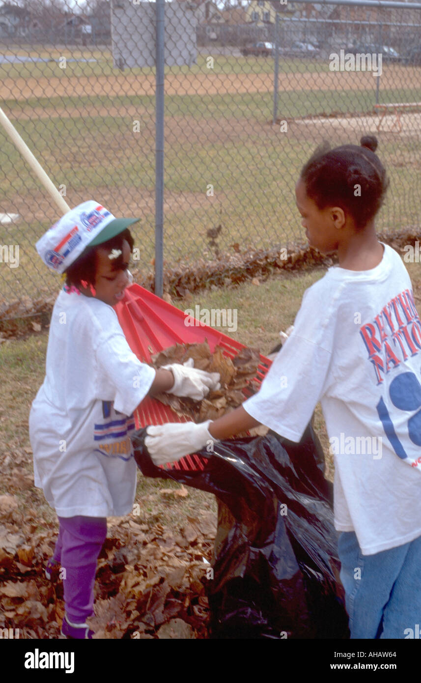 Youth ages 6 and 8 bagging leaves at Youth Express annual Dunning Field ...