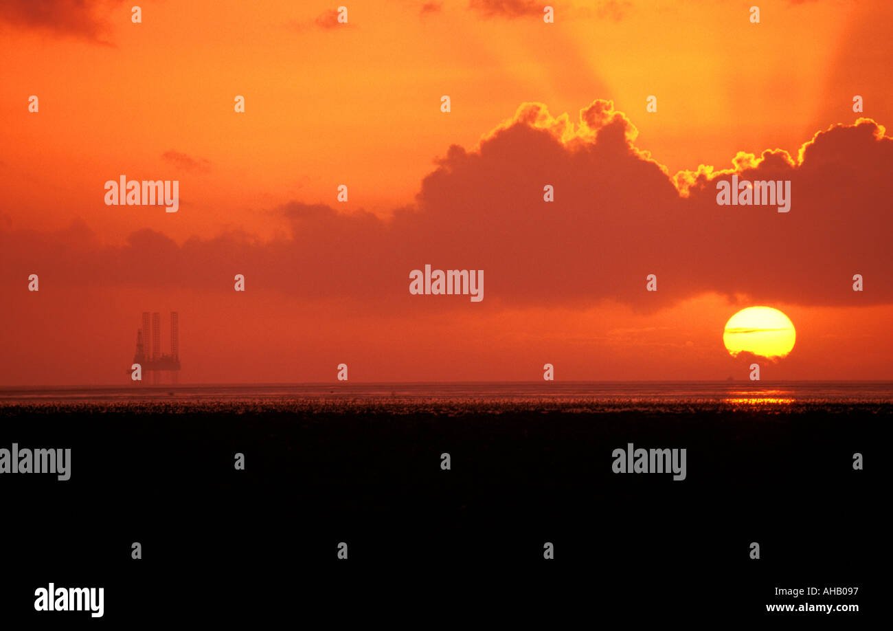 Sunset and oil rig Irish sea Stock Photo - Alamy