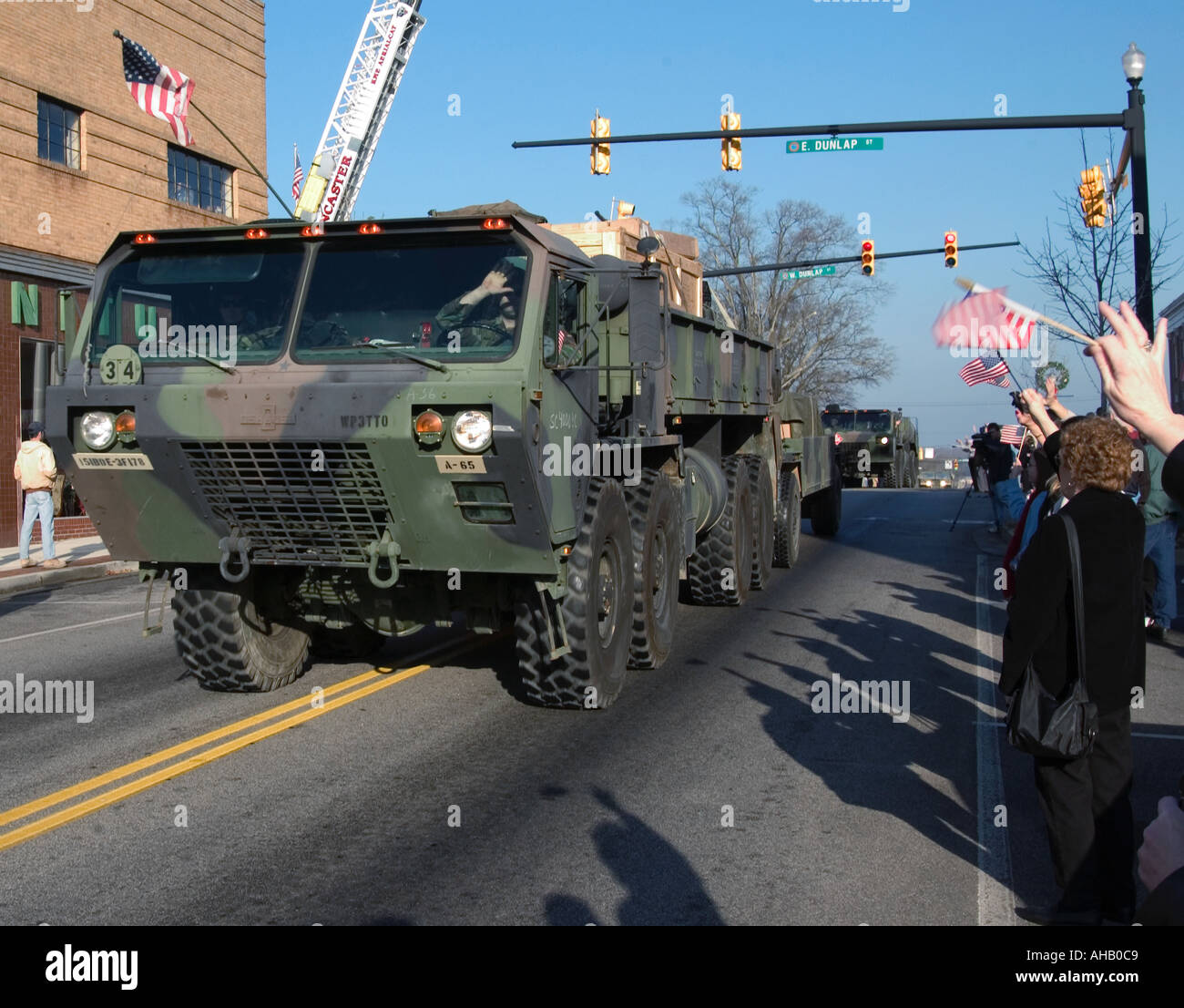 Supporters cheer on National Guard troops departing for deployment in ...