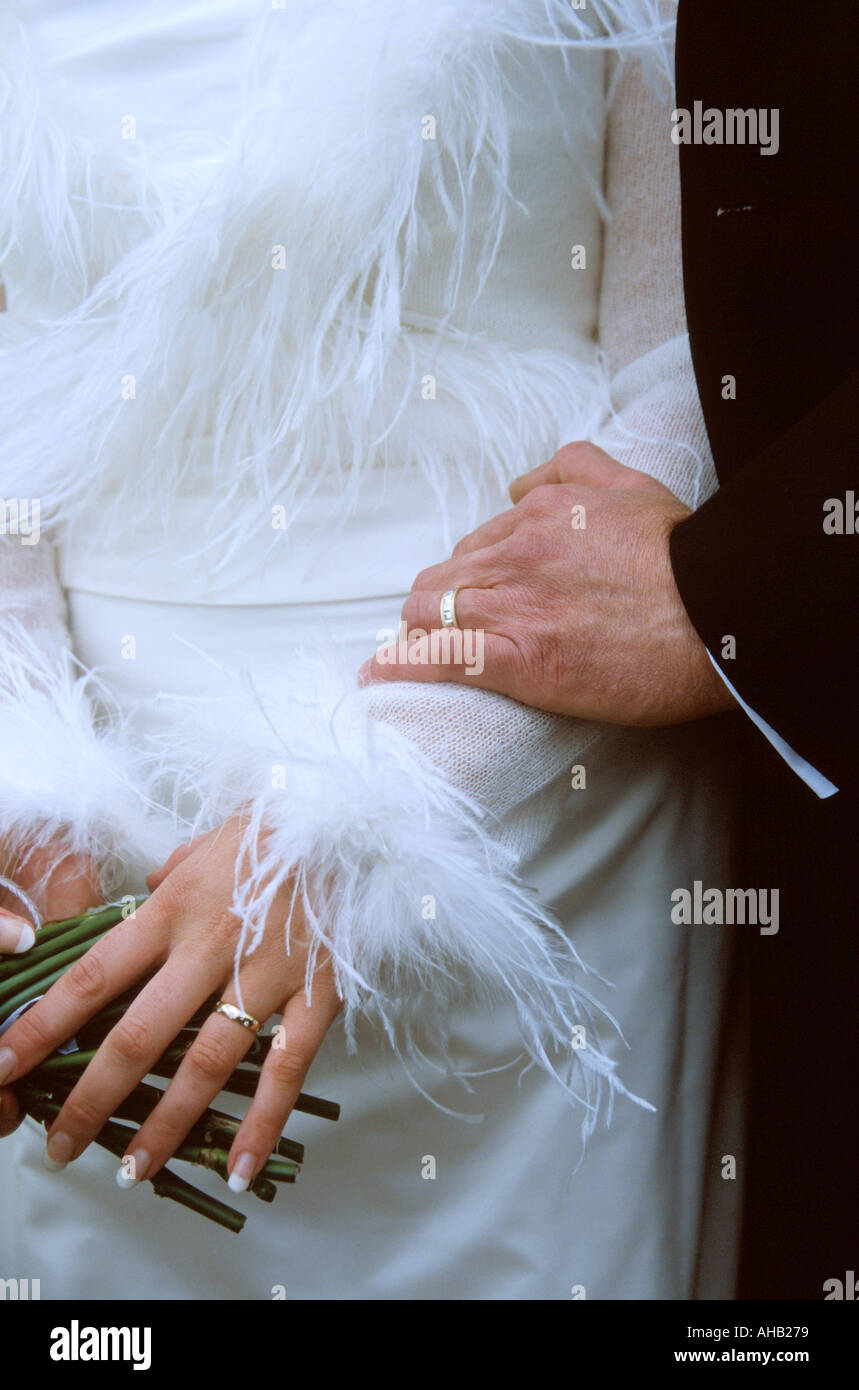 Newly married couple showing off wedding rings Stock Photo - Alamy
