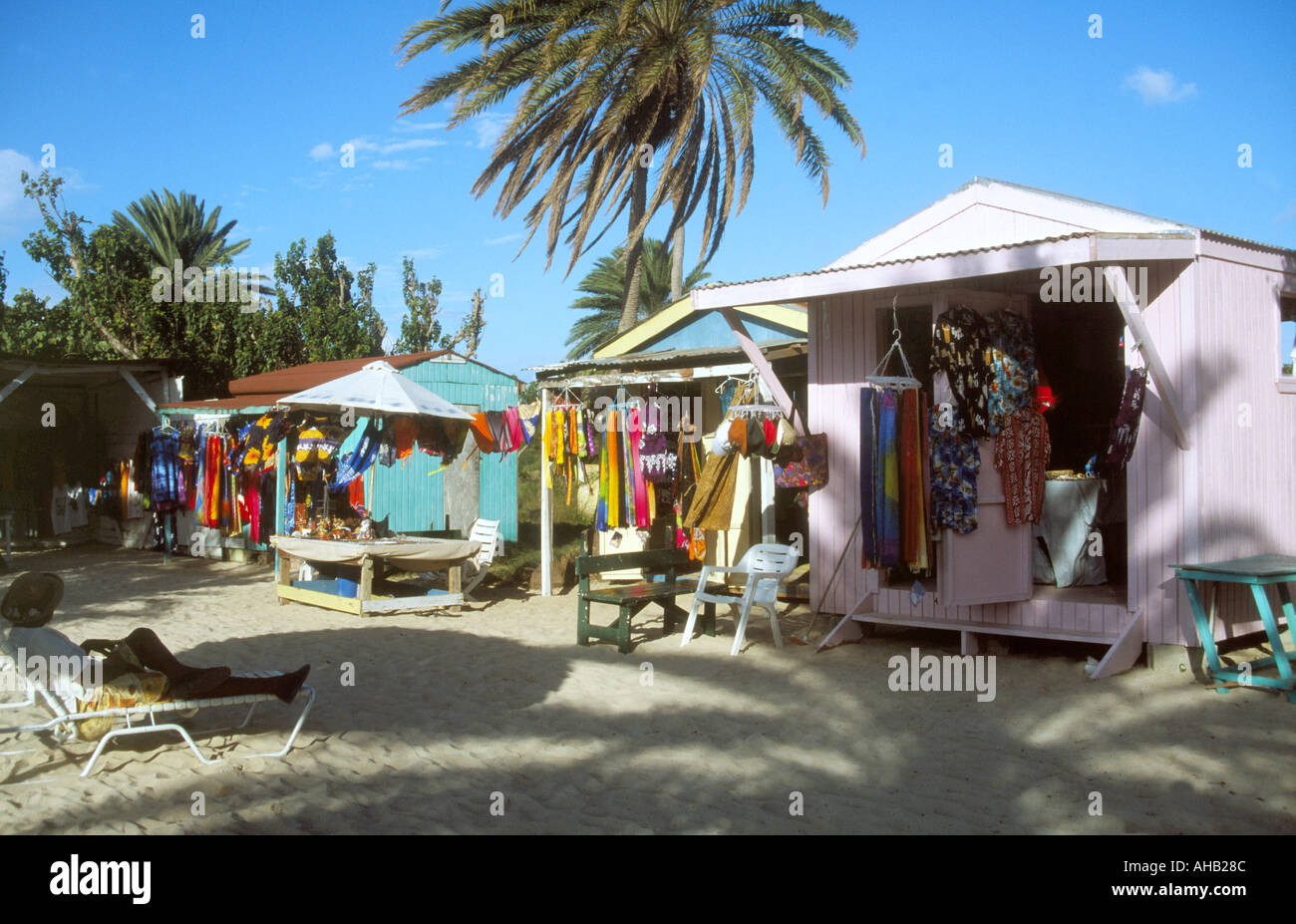Beach stalls selling clothing and souvenirs at Deep Bay Antigua ...