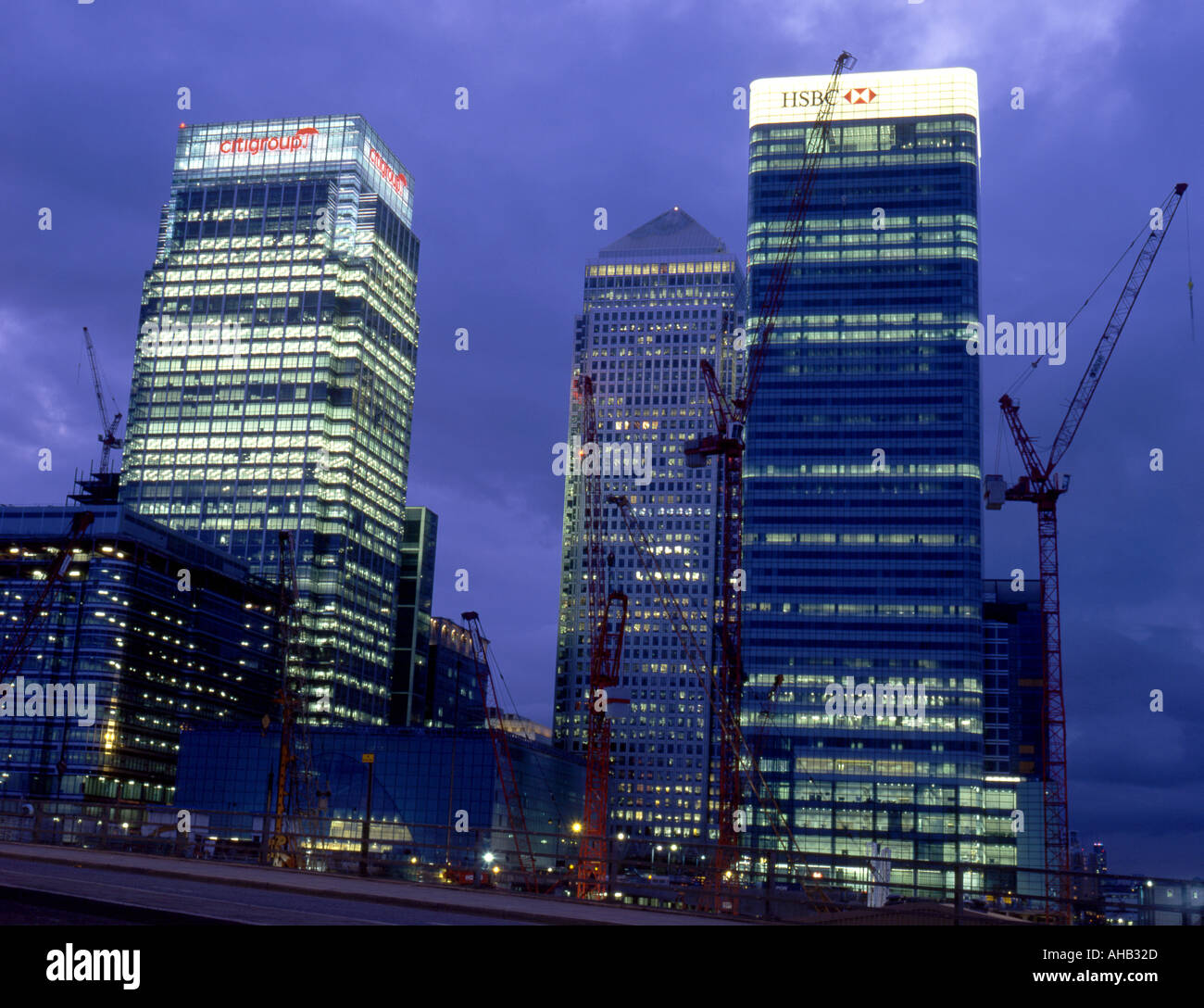 construction work goes on in London Docklands HSBC Citigroup and Canary Wharf towers at dusk ...