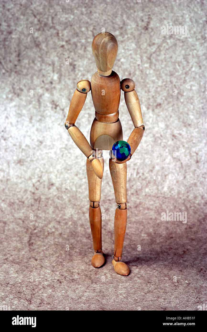 artists wooden lay figure holding a globe Stock Photo - Alamy