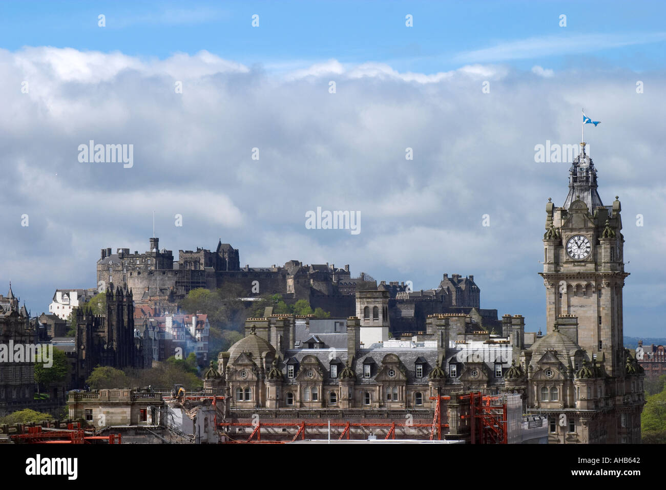 Clock tower of Balmoral Hotel with Edinburgh Castle in the background ...