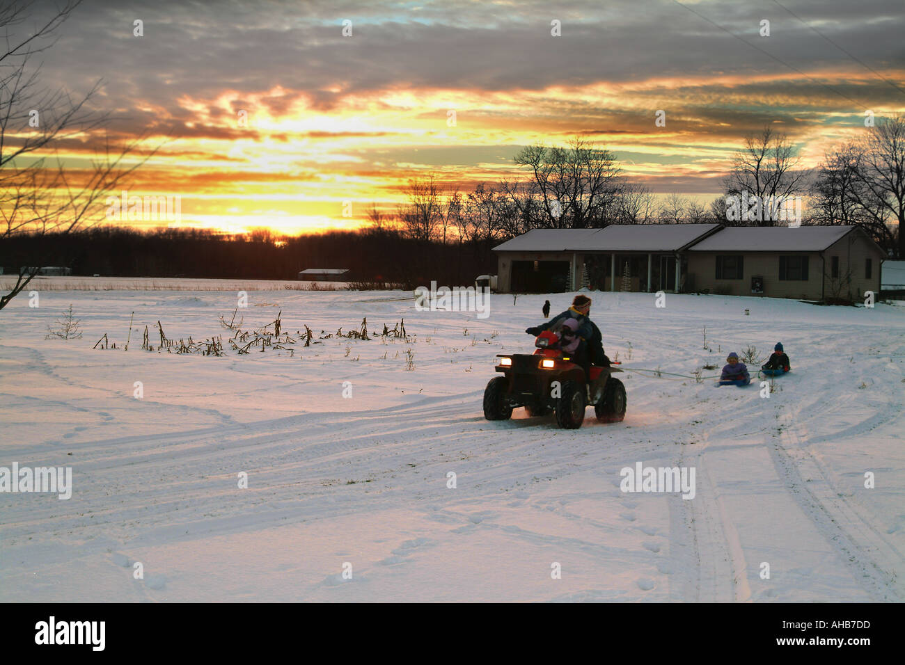 Quad Four Wheel All Terrain Vehicle ATV Riding THrough Snow In Michigan ...