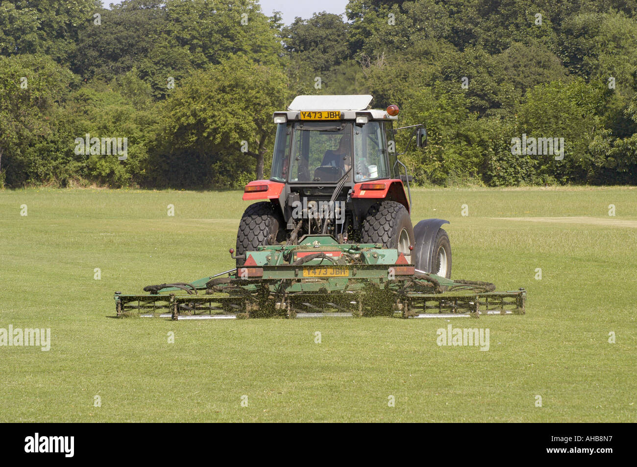 tractor cutting the grass on the cricket pitch Stock Photo - Alamy