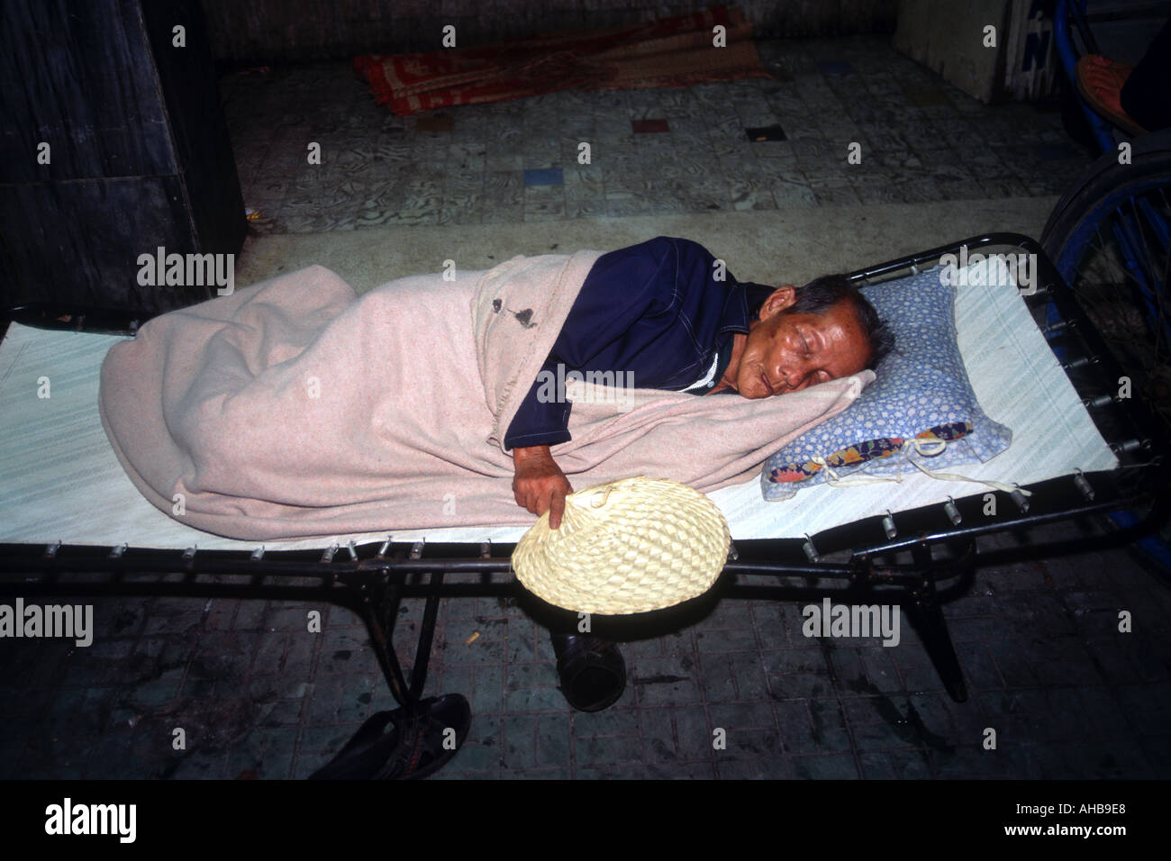 June 1996 Saigon Vietnam Homeless man sleeping on the strret Stock ...