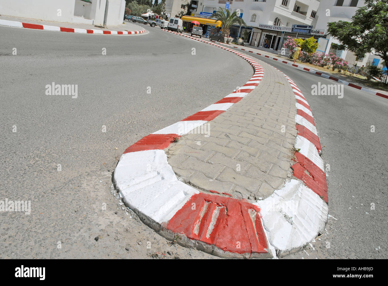 typical red and white markings on the roadside of a Tunisian inner city ...