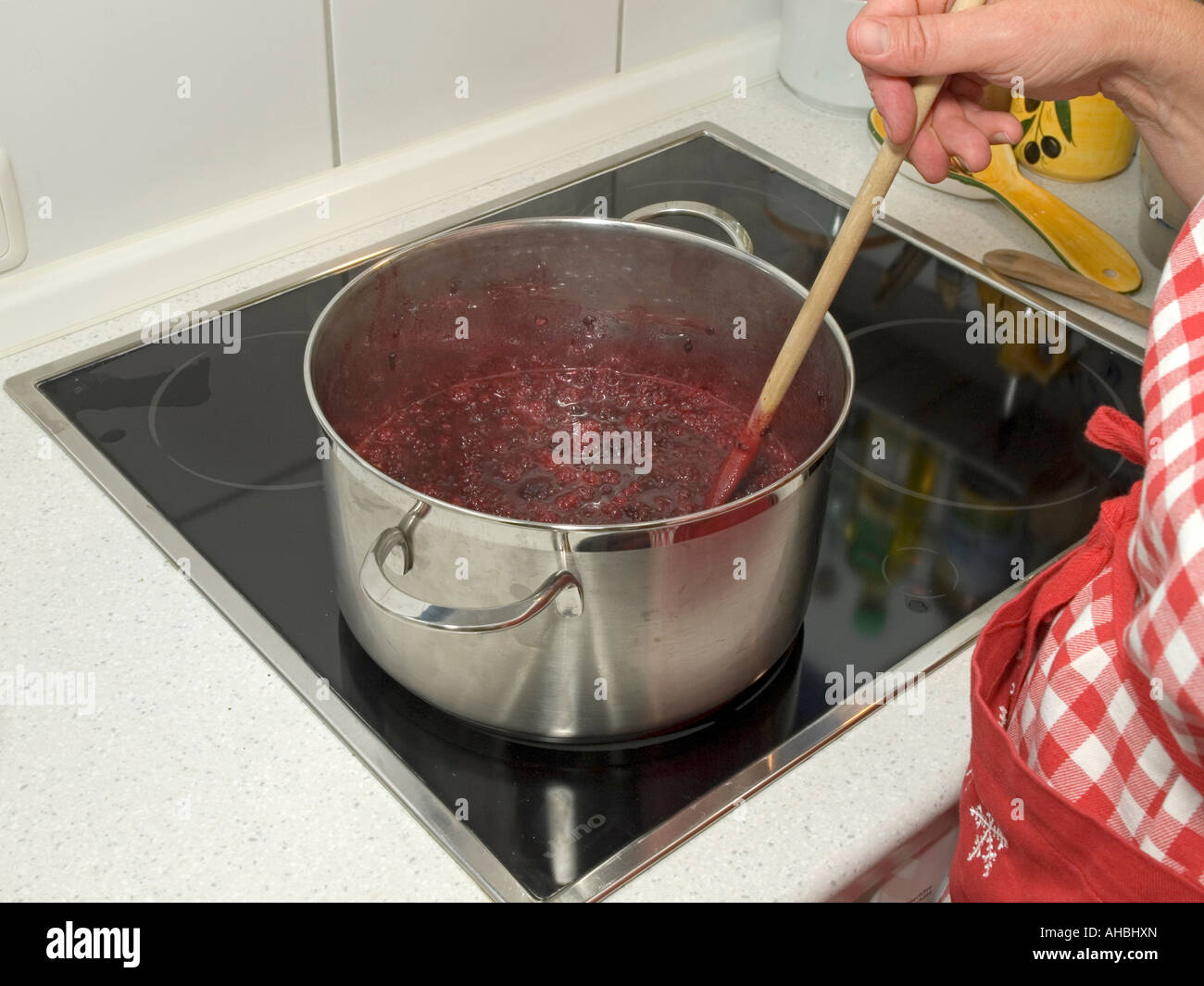 making jam from blueberries in cooking pot on cooker MR Stock Photo - Alamy