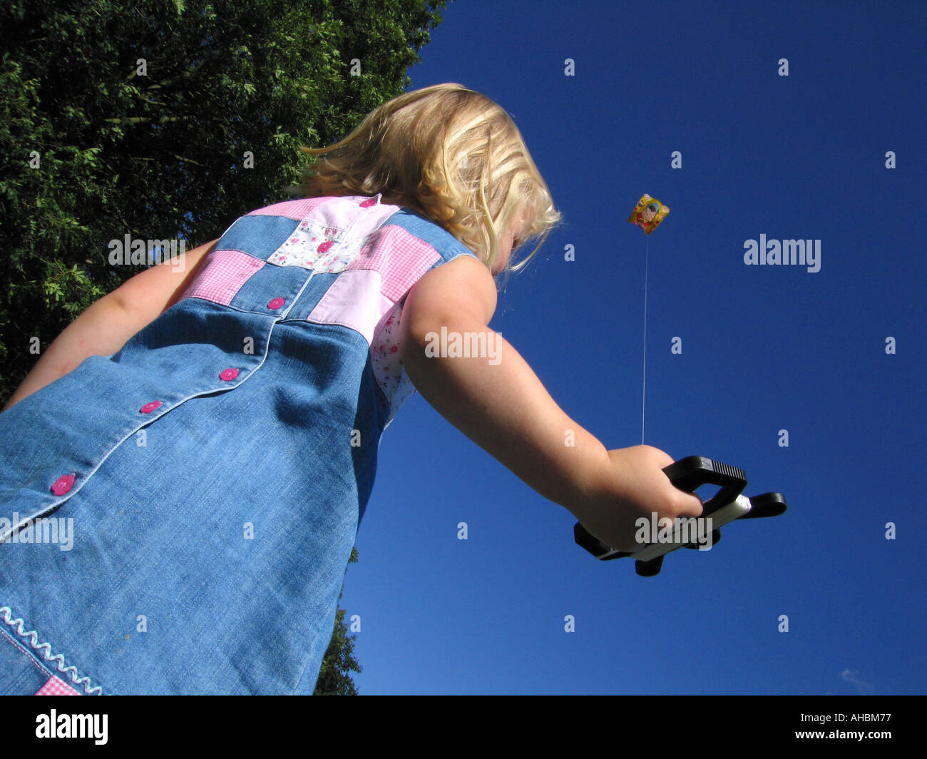 young girl flying kite Stock Photo - Alamy