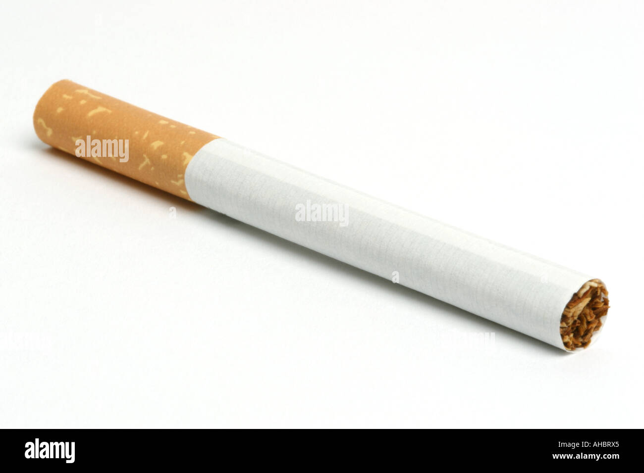 Single Cigarette on a white background Stock Photo - Alamy