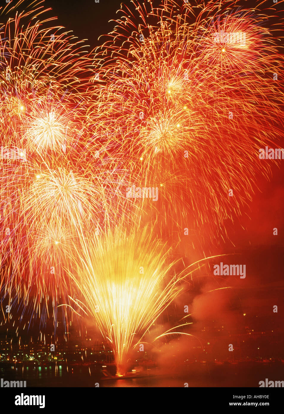 Fireworks exploding against night sky Stock Photo - Alamy
