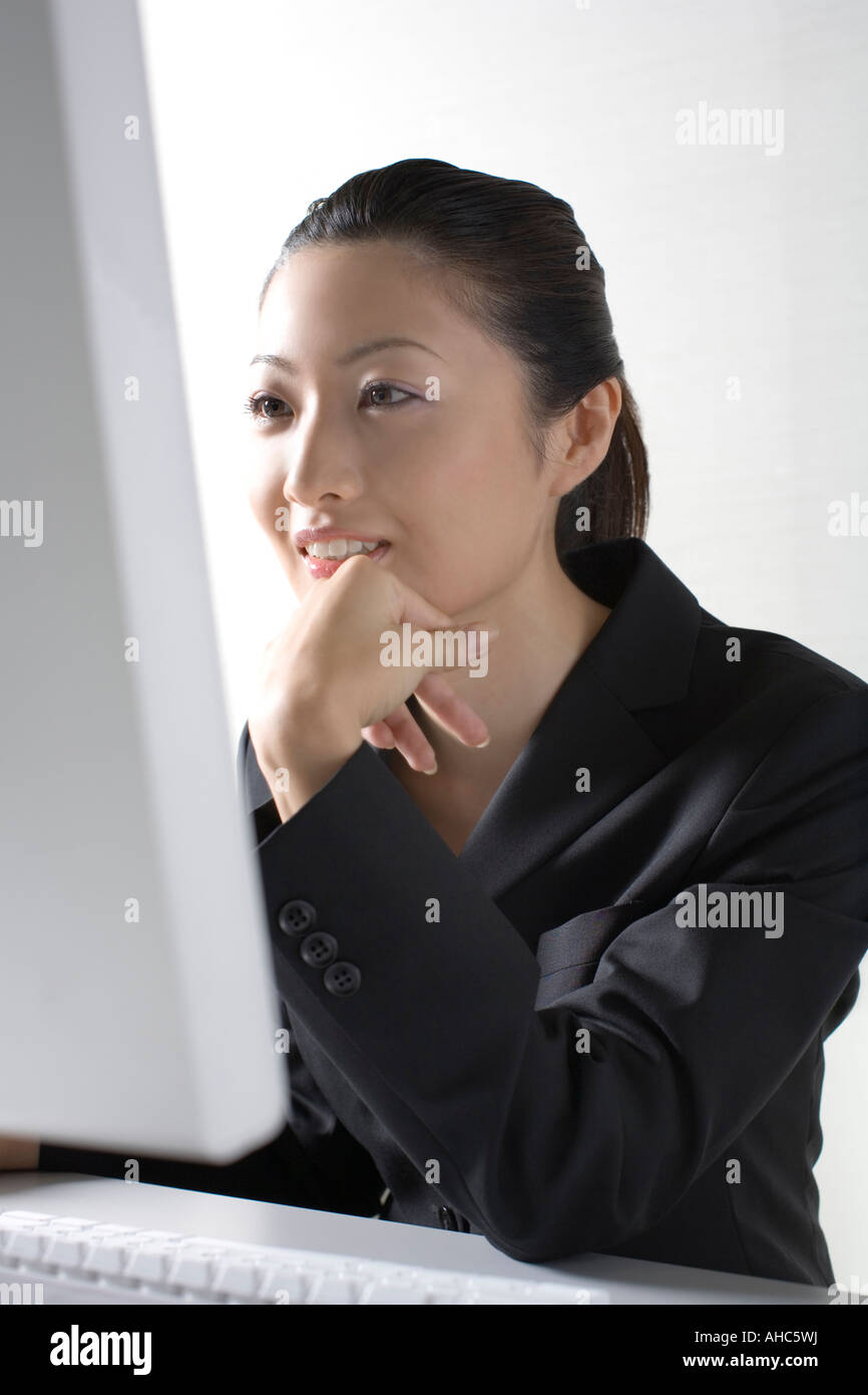 Woman operating a PC Stock Photo - Alamy